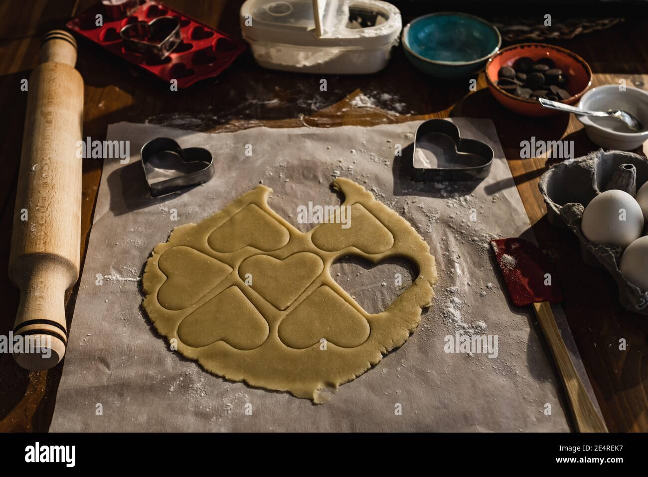 Making heart cookies with a mold from raw dough. romantic cookie molds ...
