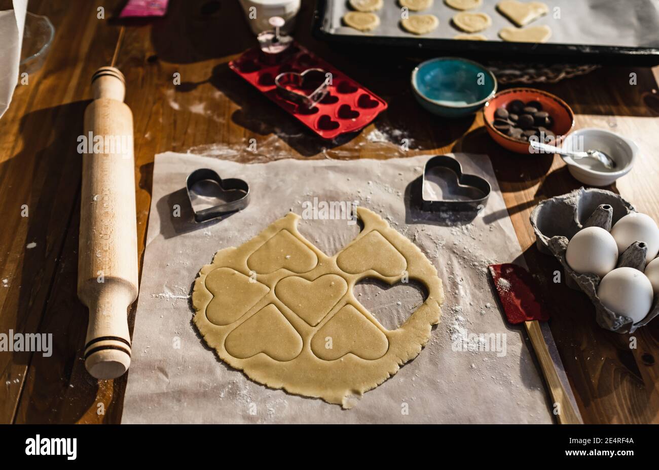 Making heart cookies with a mold from raw dough. romantic cookie molds ...