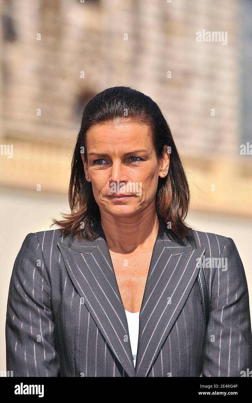 Princess Stephanie stands near the giant cake during Albert II of ...