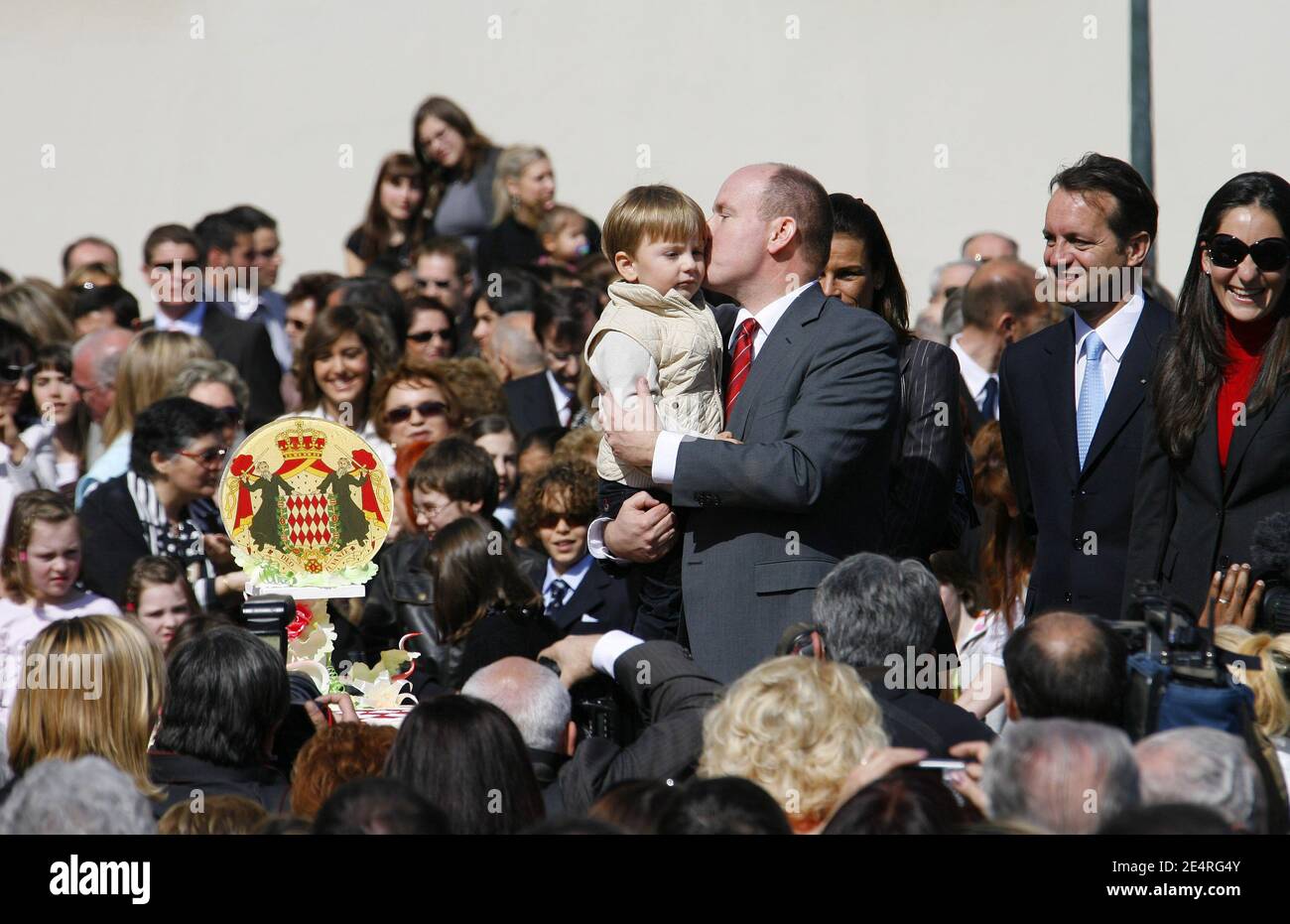 City mayor Georges Marsan, Prince Albert II of Monaco kisses Matheo ...
