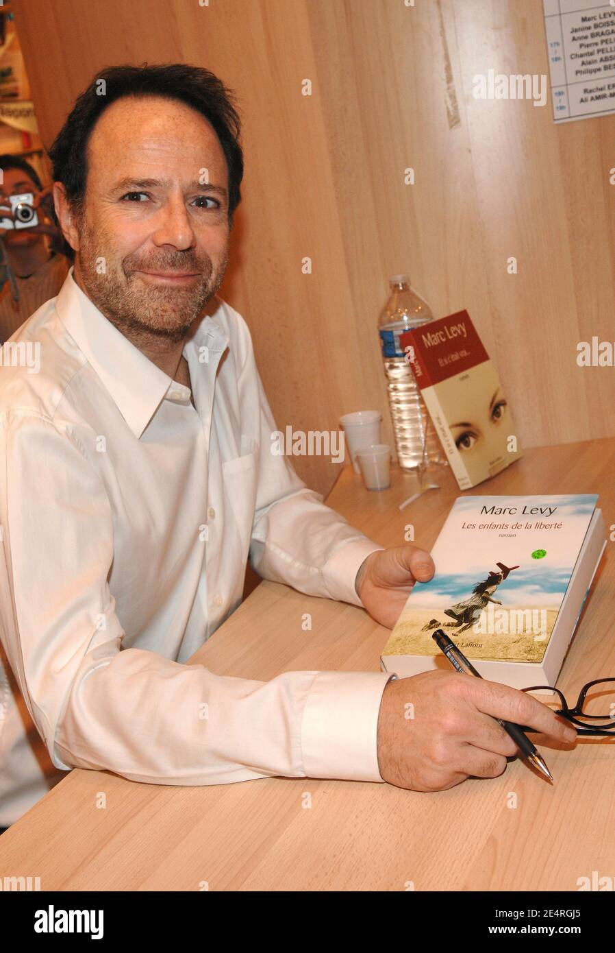 Author Marc Levy attends the 'Salon du Livre' (Paris Book Fair) held at ...