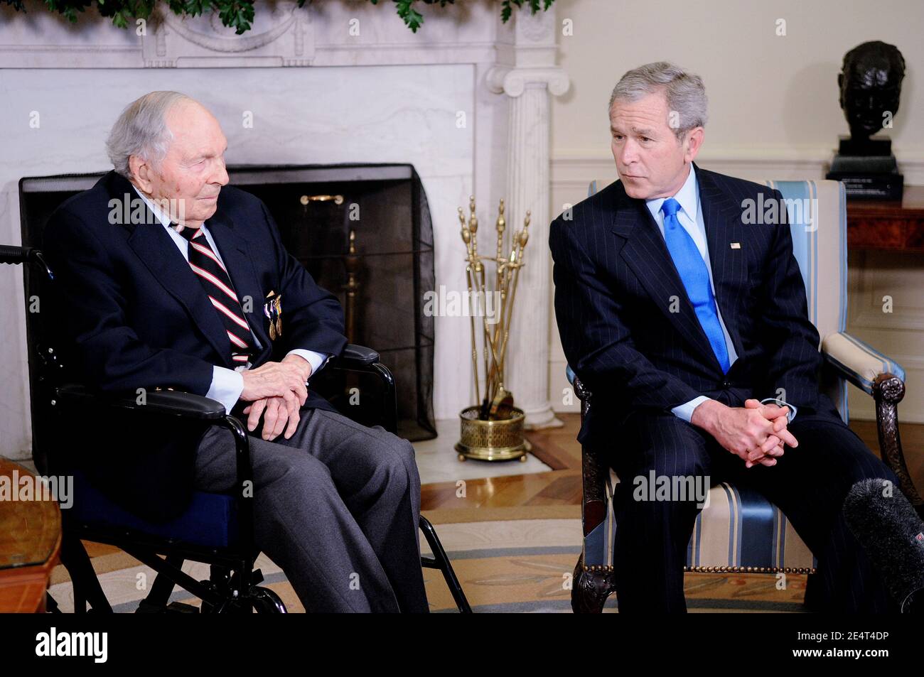 President George W. Bush participates in a photo op with Corporal Frank ...