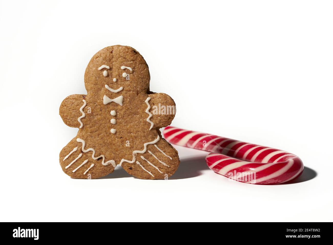 Standing gingerbread man with shadow and lollipop isolated on white ...