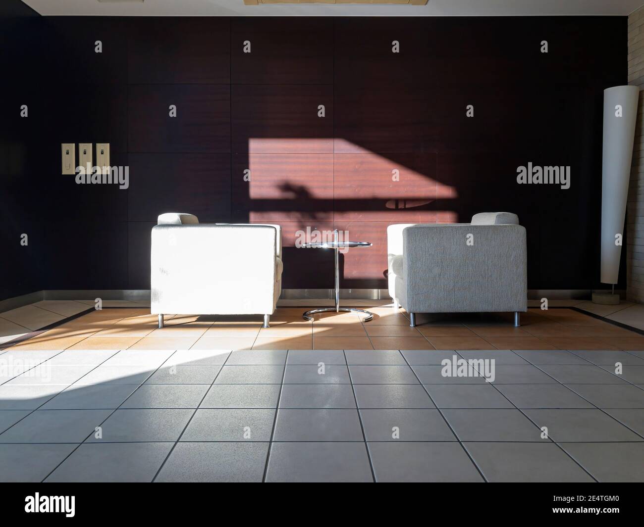 Interior view of a building complex hallway with two sofa at Japan ...