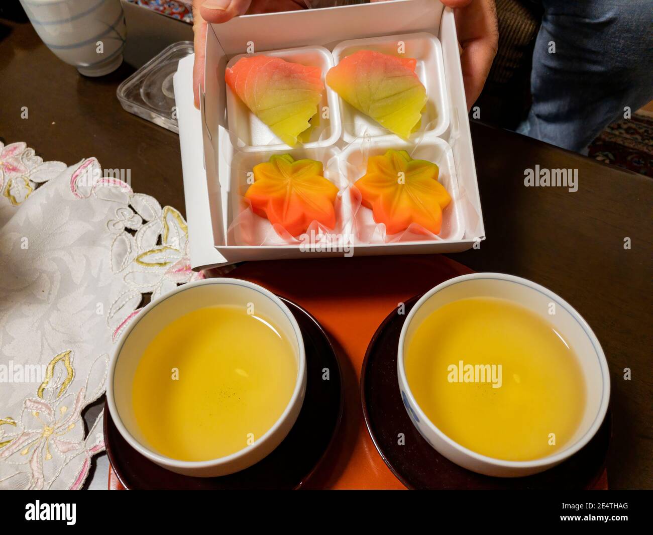 Close up shot of maple shape Japanese confectionery and green tea at ...