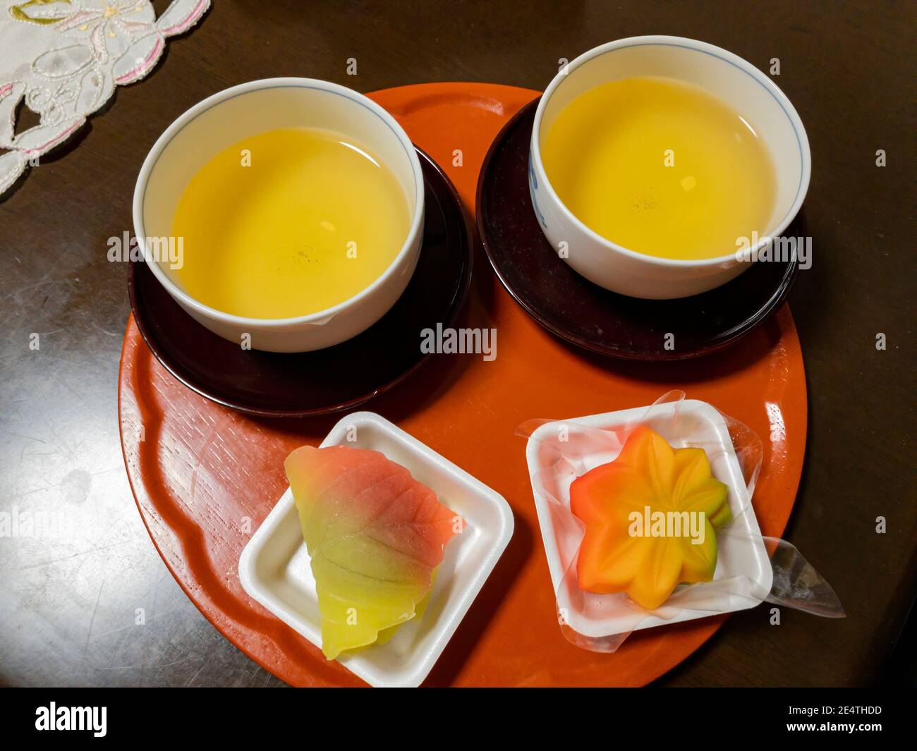 Close up shot of maple shape Japanese confectionery and green tea at ...