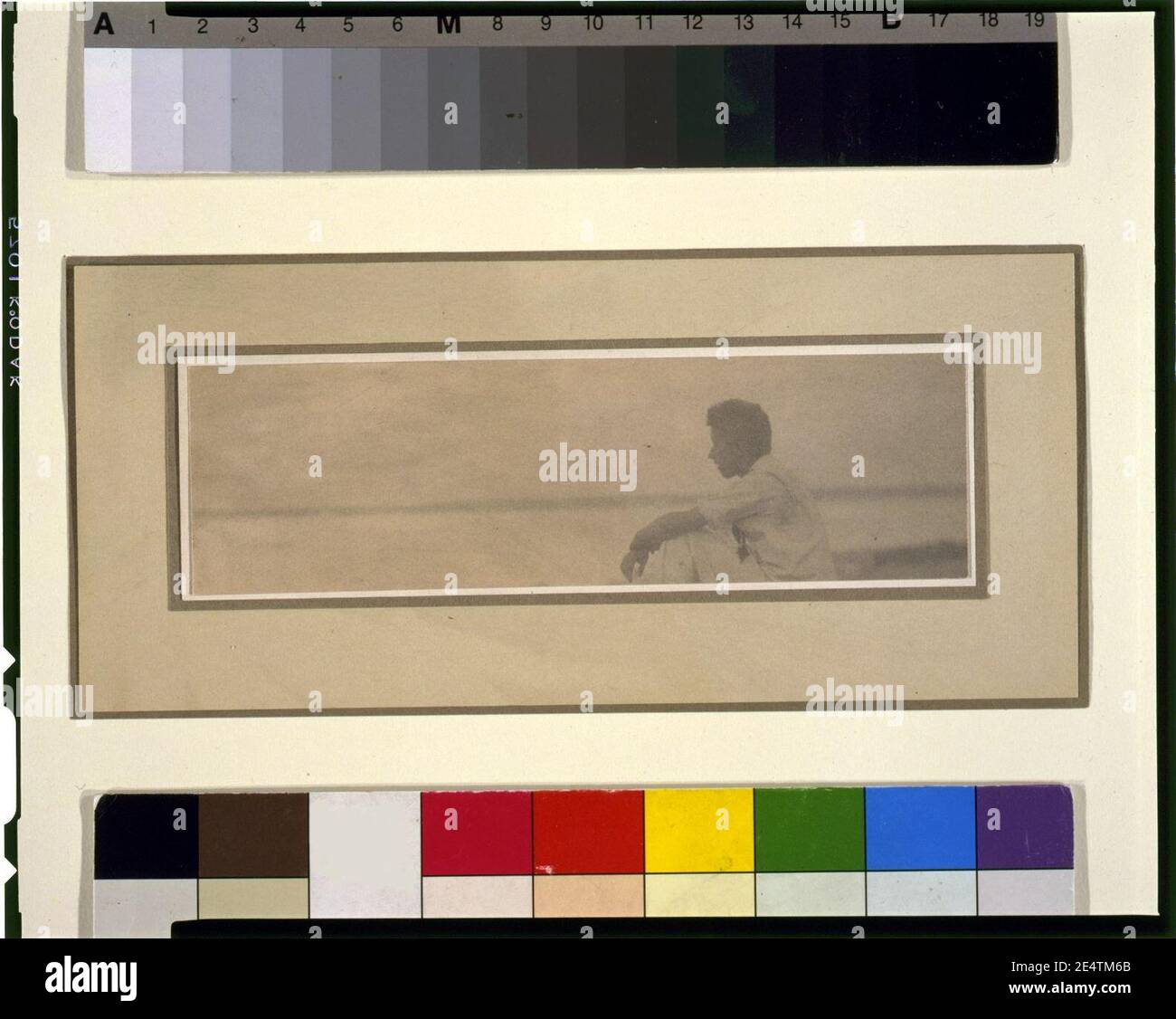 Maynard White on seashore, seated, profile Stock Photo - Alamy