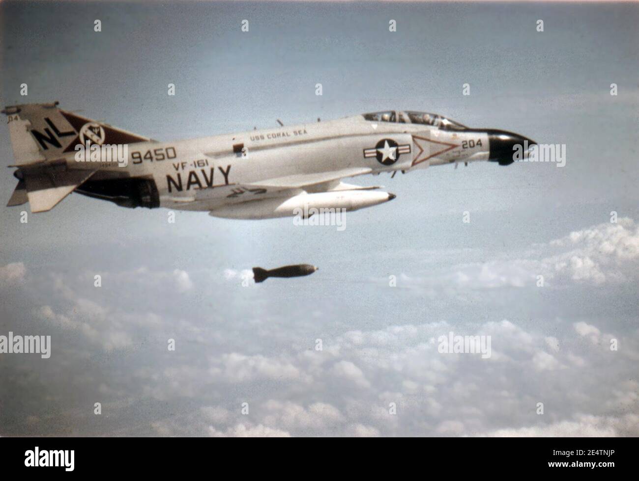 McDonnell F-4B Phantom II of VF-161 drops M117 bomb over Vietnam, circa ...