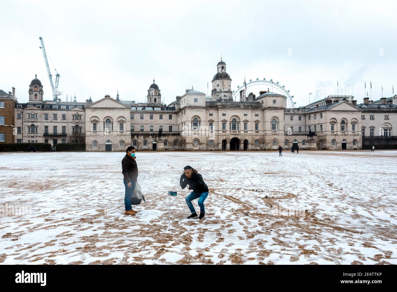 People taking photos in front of Buckingham Palace during the snow ...