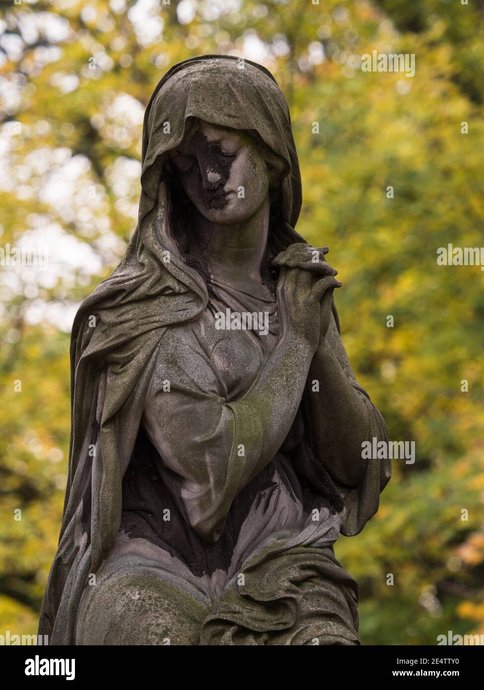 Closeup view of female statue woman sculpture folding hands prayer ...