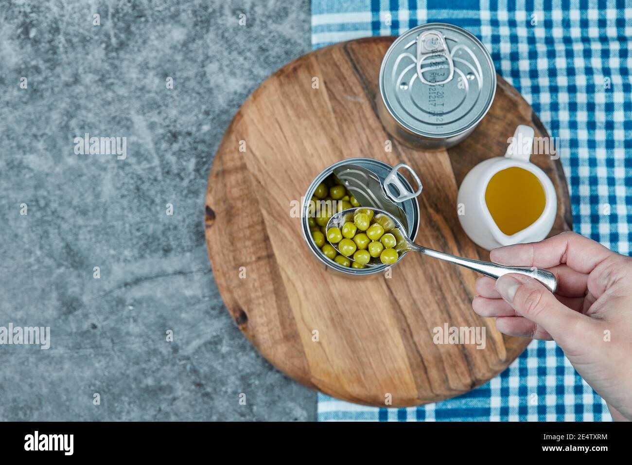 Marinated green beans in the metallic can with olive oil around Stock ...
