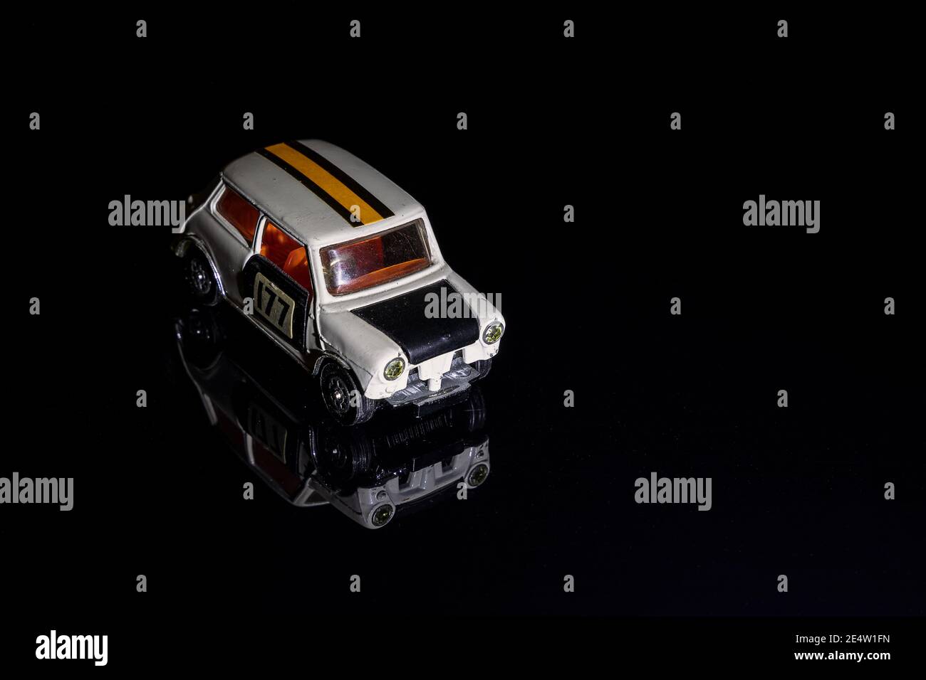 An old mini rusty toy car isolated on a black background Stock Photo ...