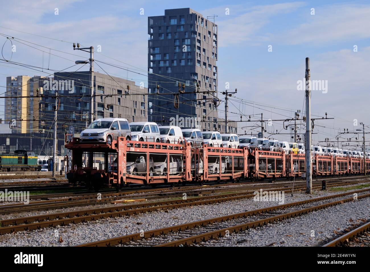 cargo train loaded with cars for delivery on tracks in european station ...