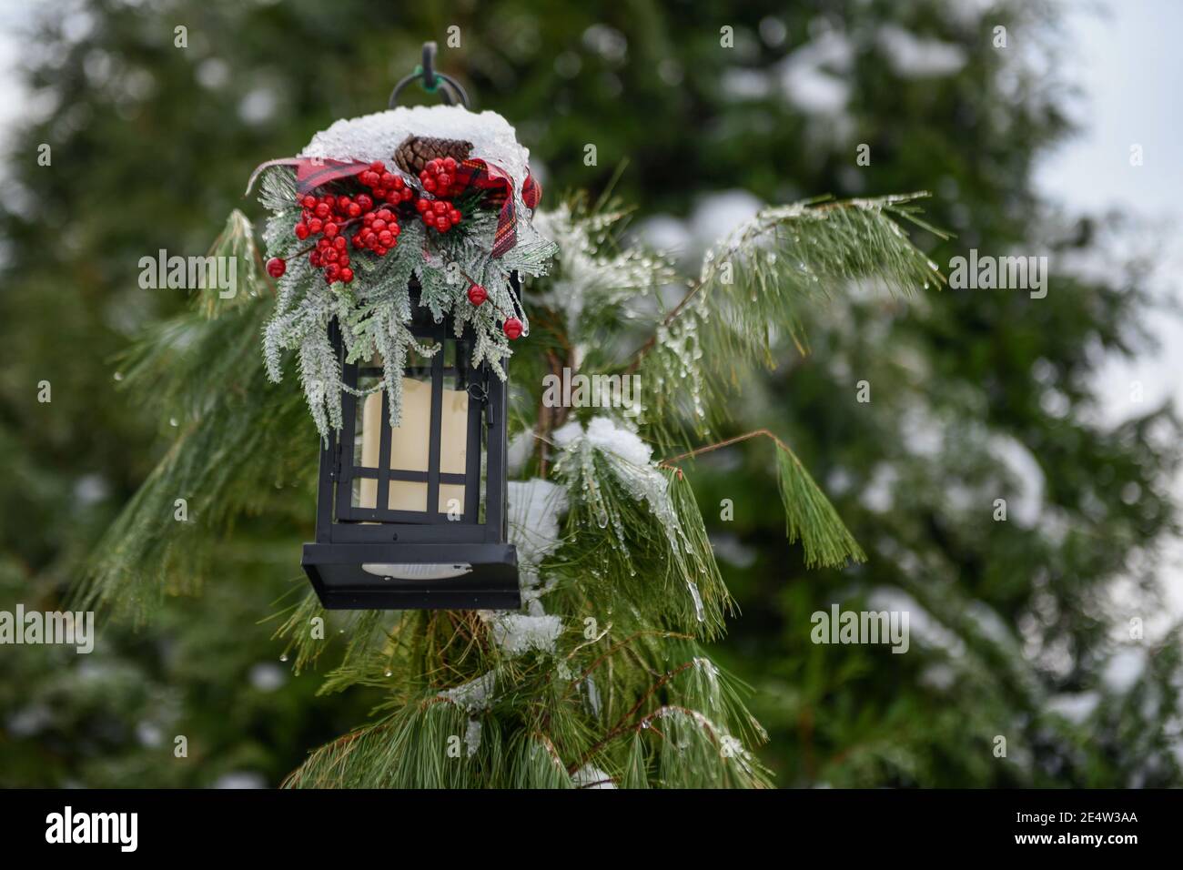Holiday decorations in snow - snowy outdoor Christmas decorations Stock ...