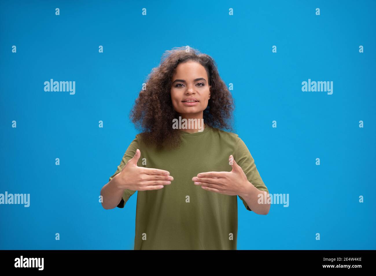 Pretty african american girl saying HELLO using her hands to ...
