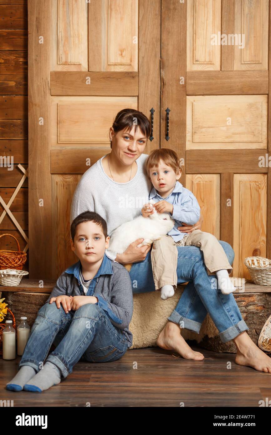 Portrait of kids on rural background with easter bunny. Country style ...