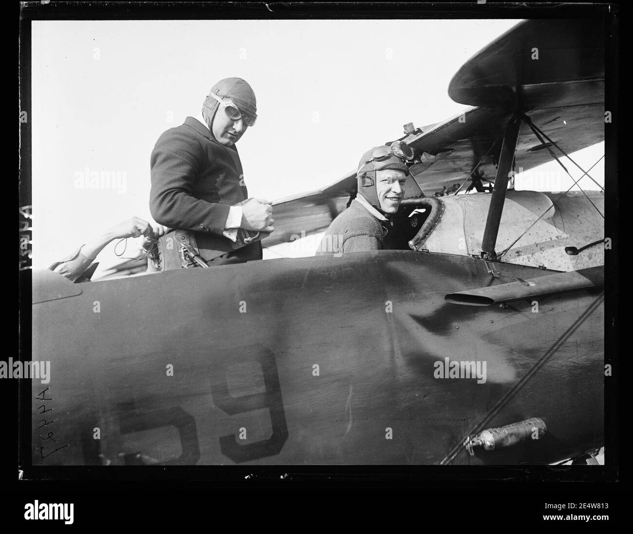 Men in airplane Stock Photo - Alamy