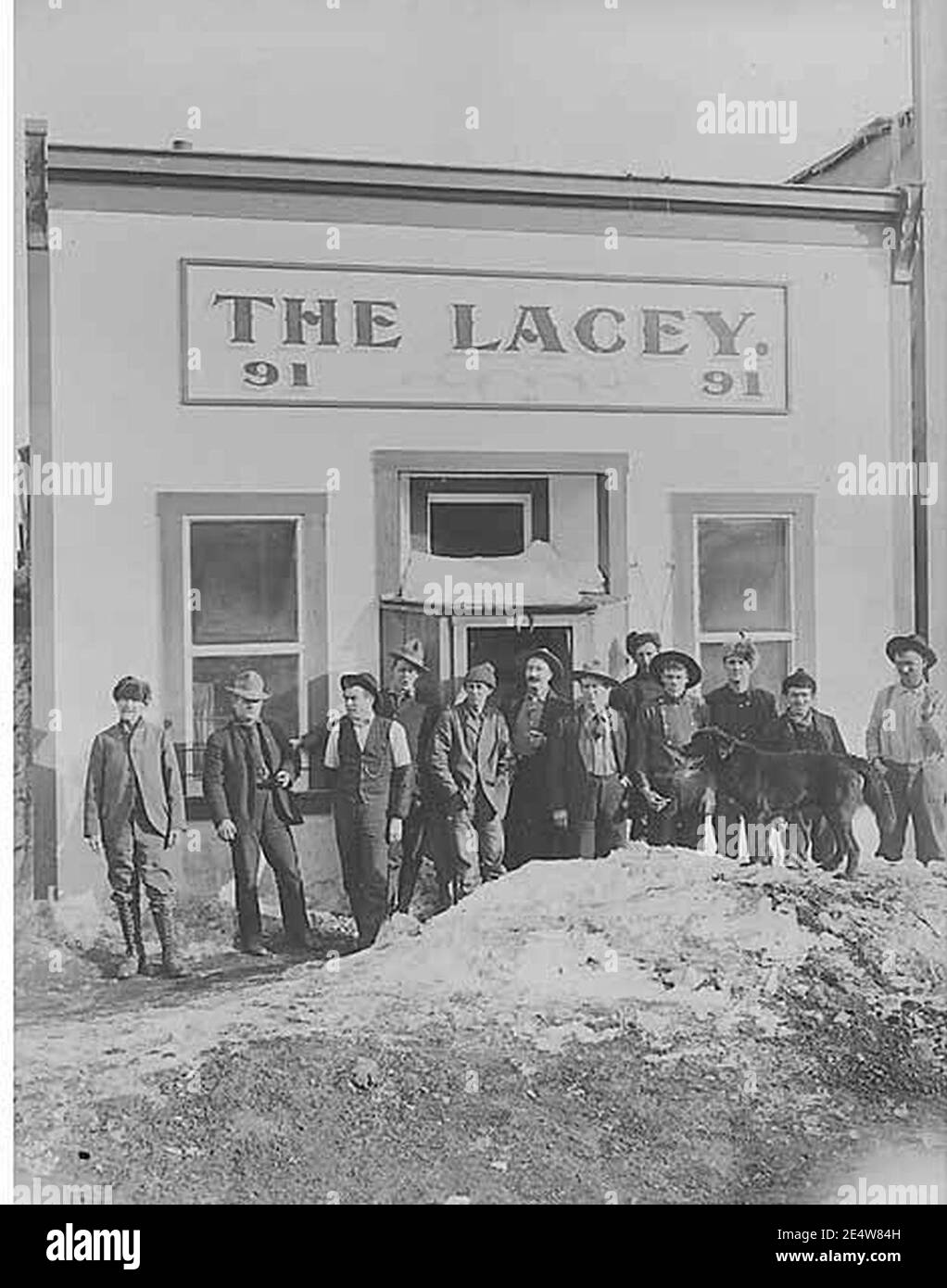 Men standing in front of the Lacey building, Candle, Alaska, circa 1907 ...