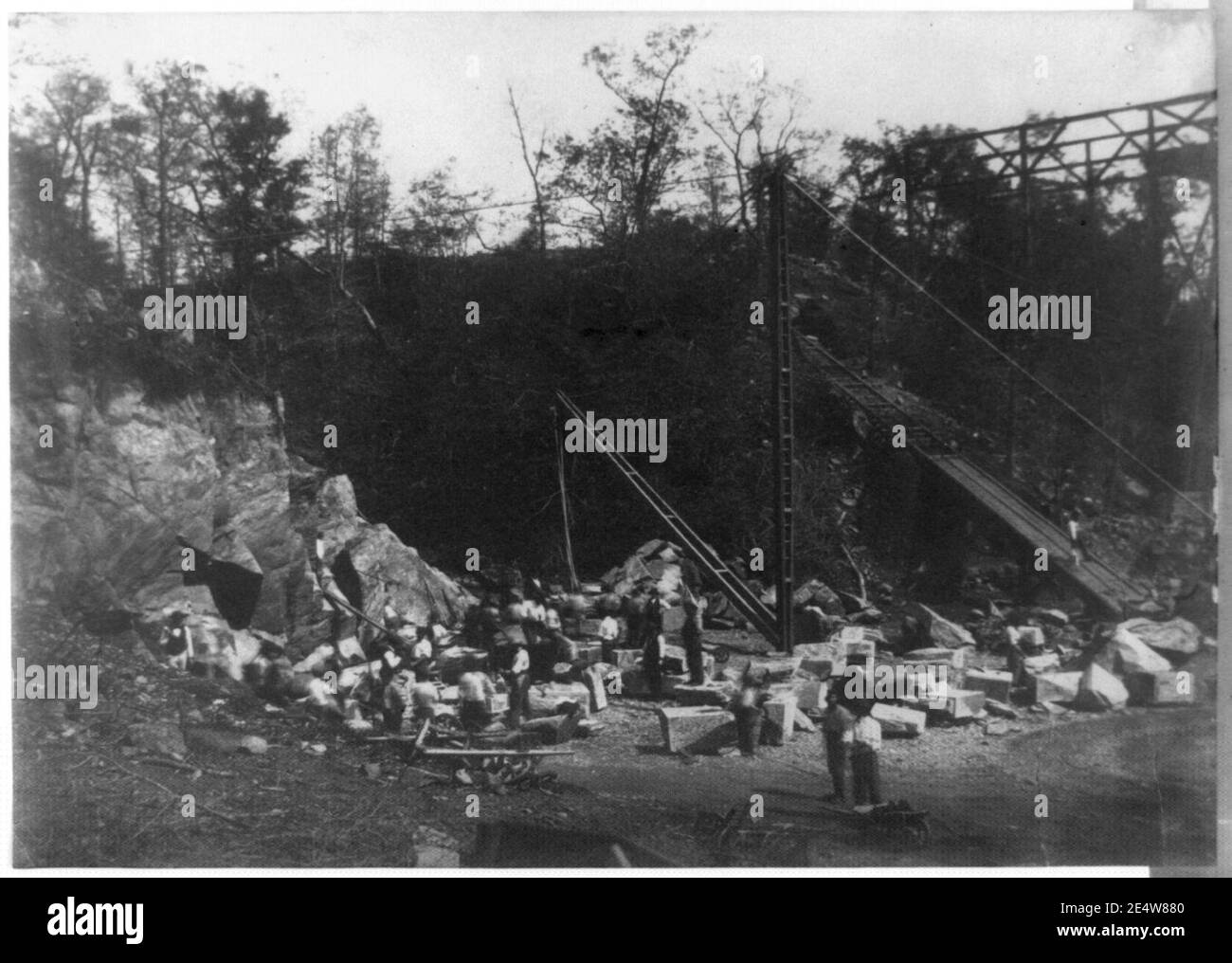 Men working with large stone blocks Stock Photo - Alamy