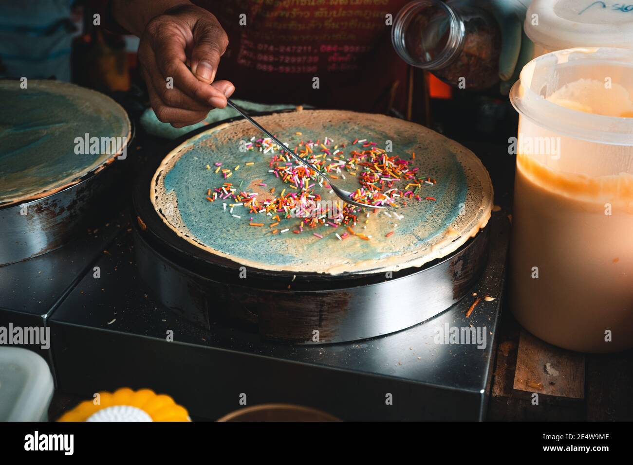 Crispy crepes are being made in the market Stock Photo - Alamy