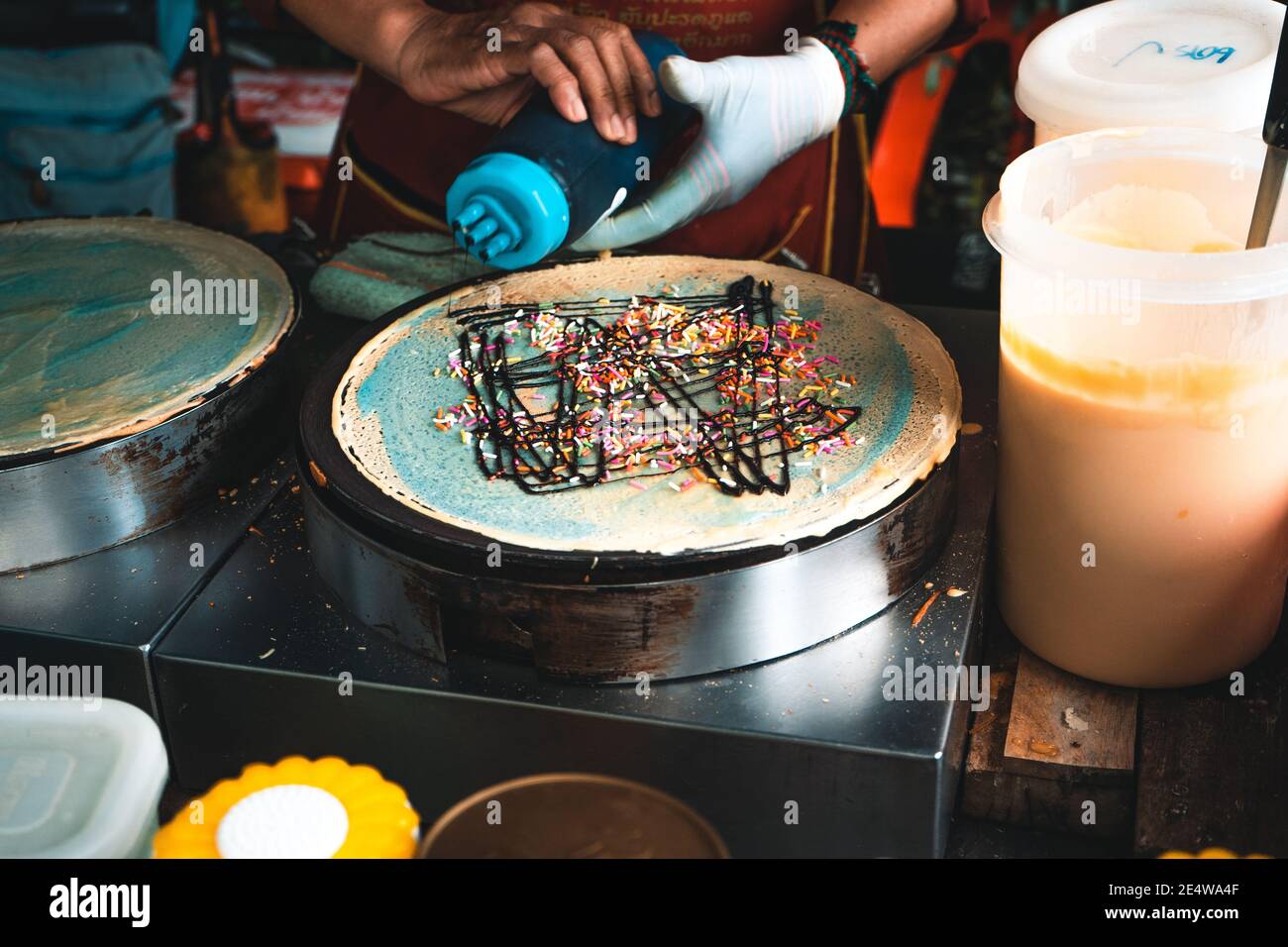 Crispy crepes are being made in the market Stock Photo - Alamy
