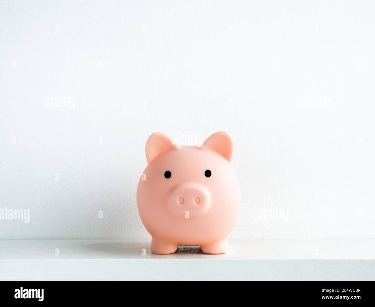 Cute piggy bank, pink color, front view isolated on white background ...