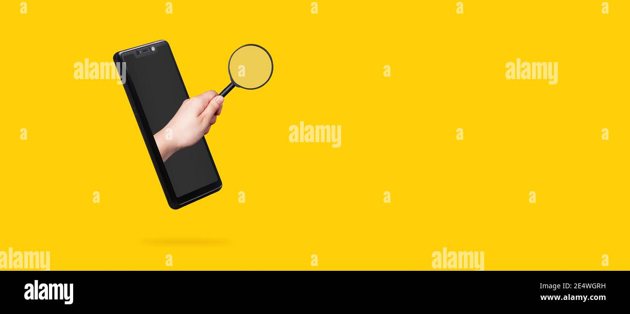 Hand holding magnifying glass, sticking out of the smartphone screen ...