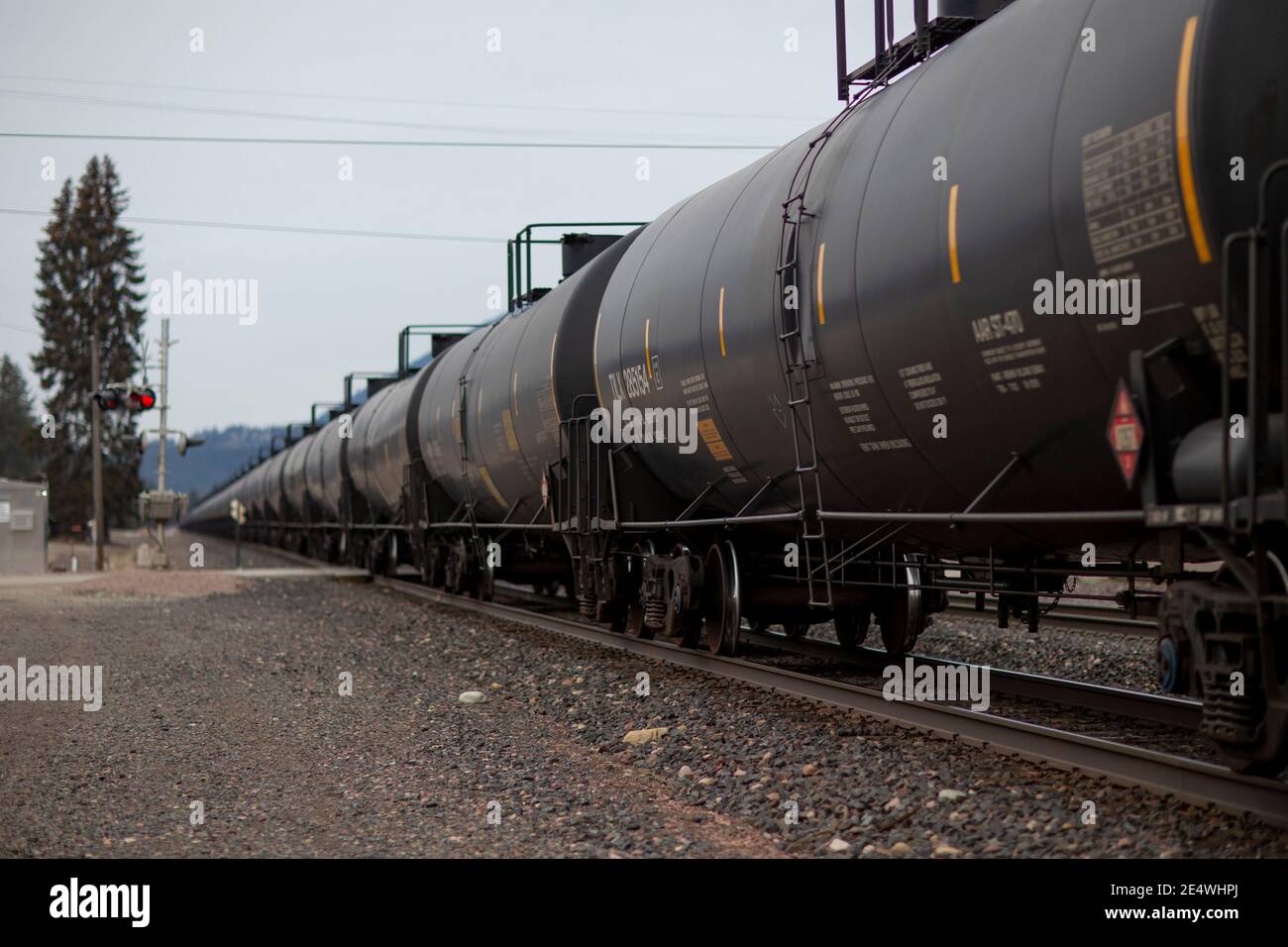 A line of DOT-111 railroad tanker cars, on the tracks at the BNSF train yard, in the town of ...