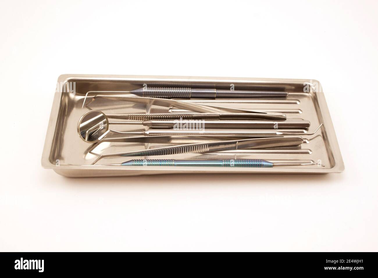 Set of dental tools for teeth care in the tray. Isolated on white ...