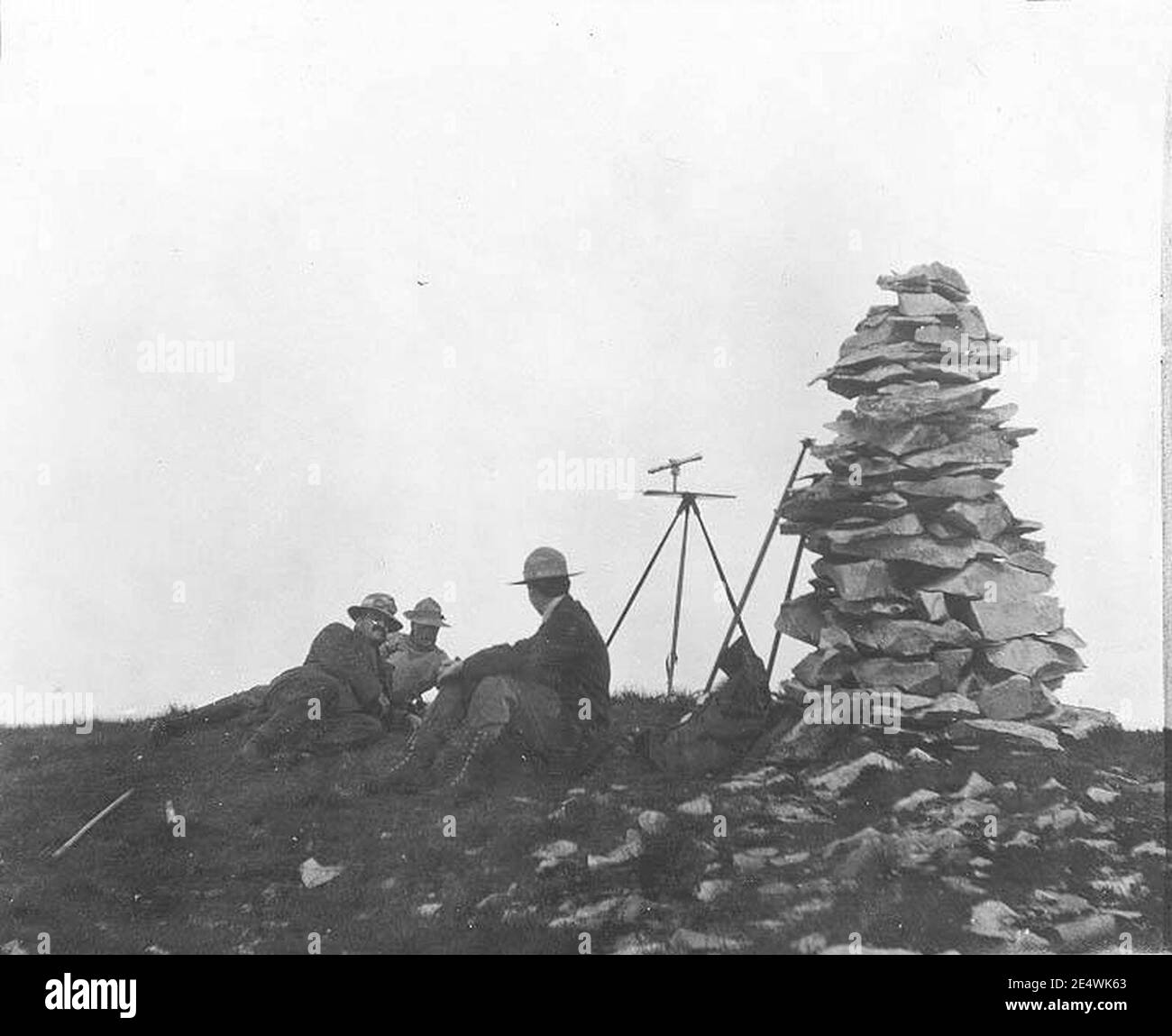 Men resting next to surveyor's equipment, Mount Rainier, ca 1910 ...