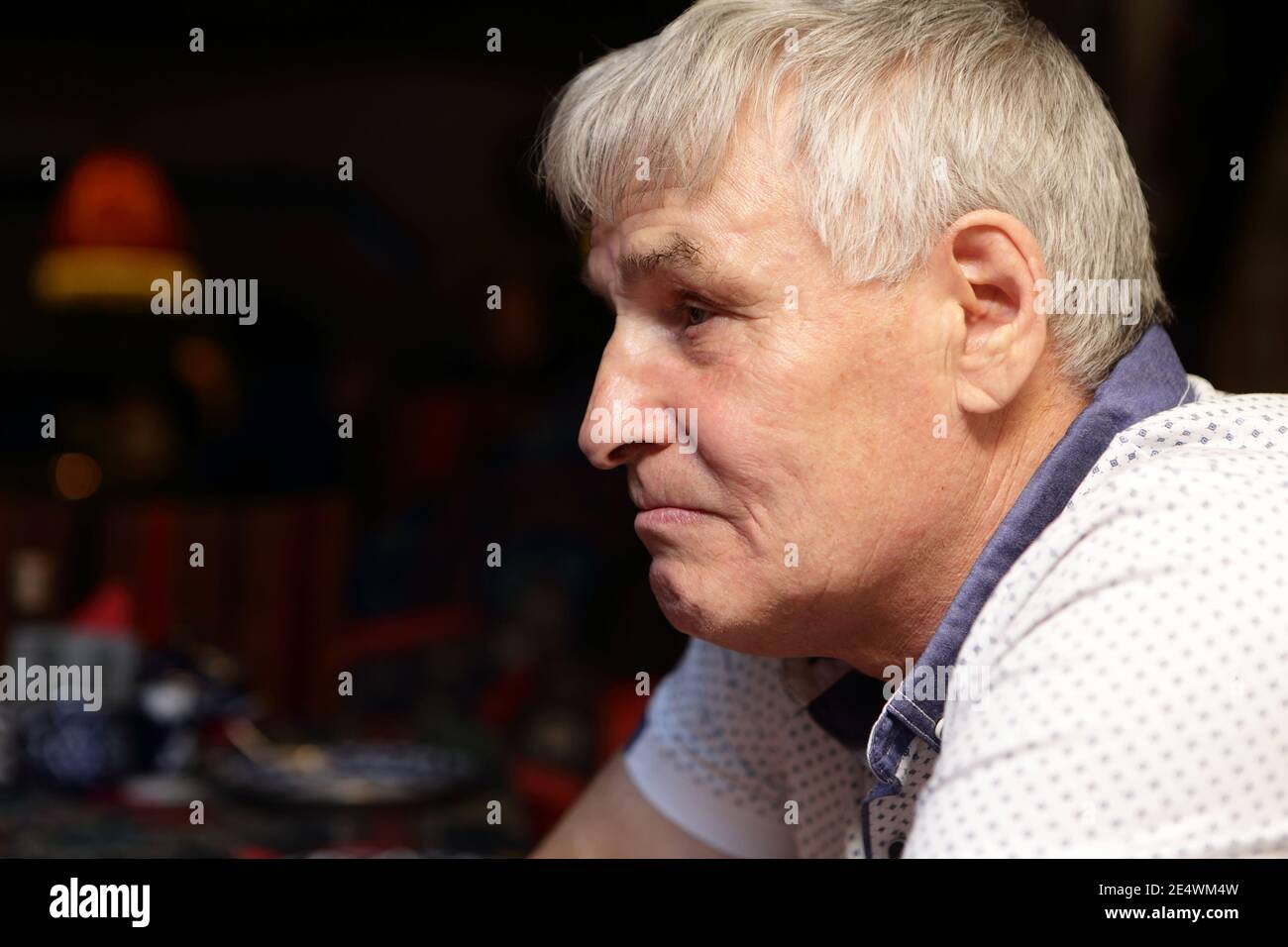 Portrait of a serious senior man indoor Stock Photo - Alamy