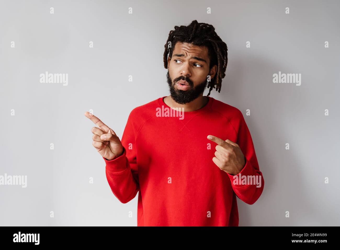 Confused african man pointing hi-res stock photography and images - Alamy