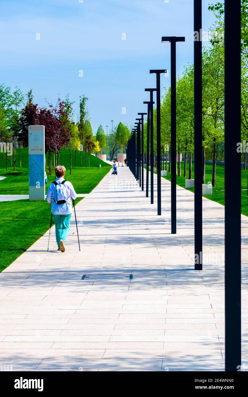 Walking path in a city park with urban lights or lanterns Stock Photo ...