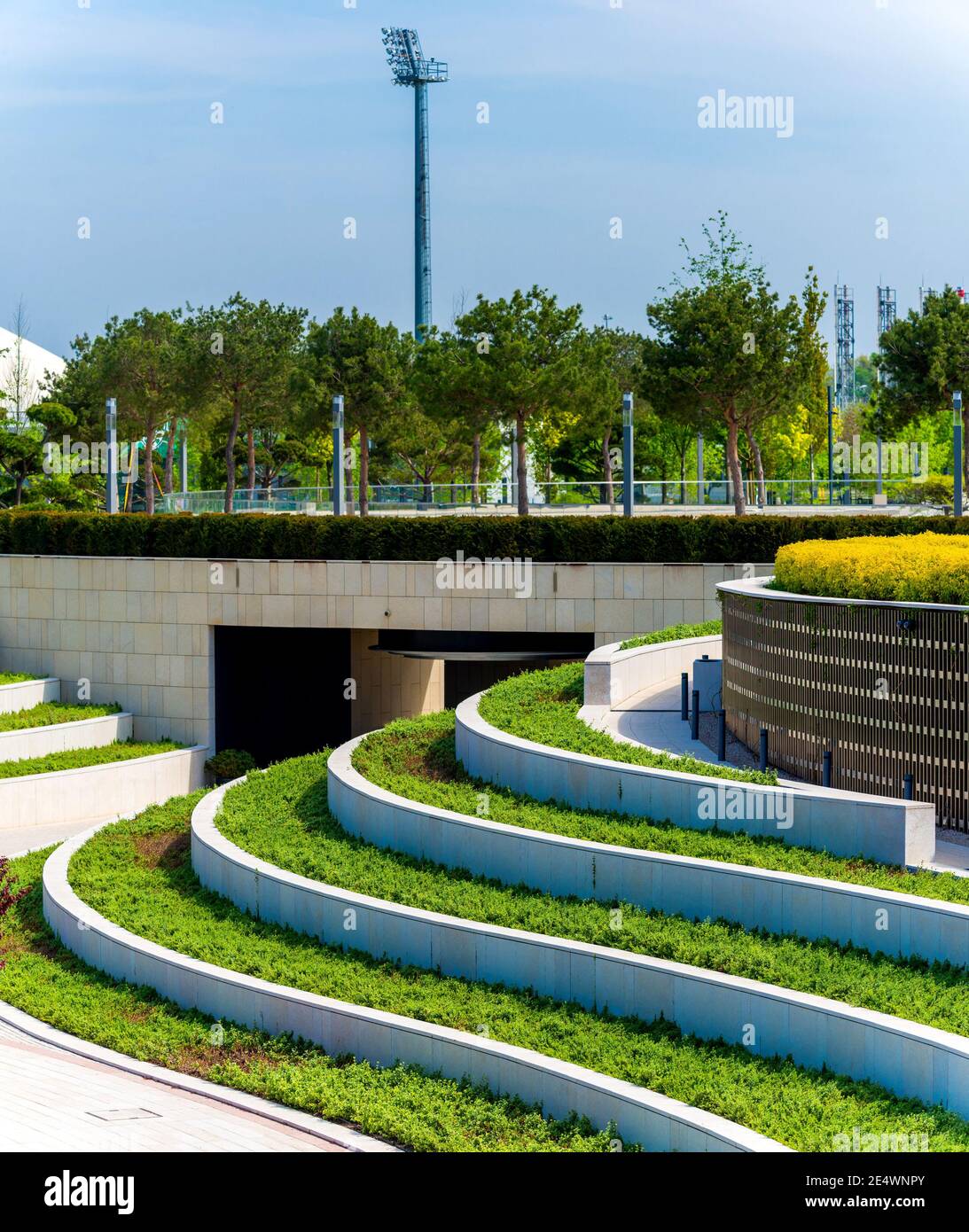 Rounded diagonal terraces on a slope in a modern city park Stock Photo ...