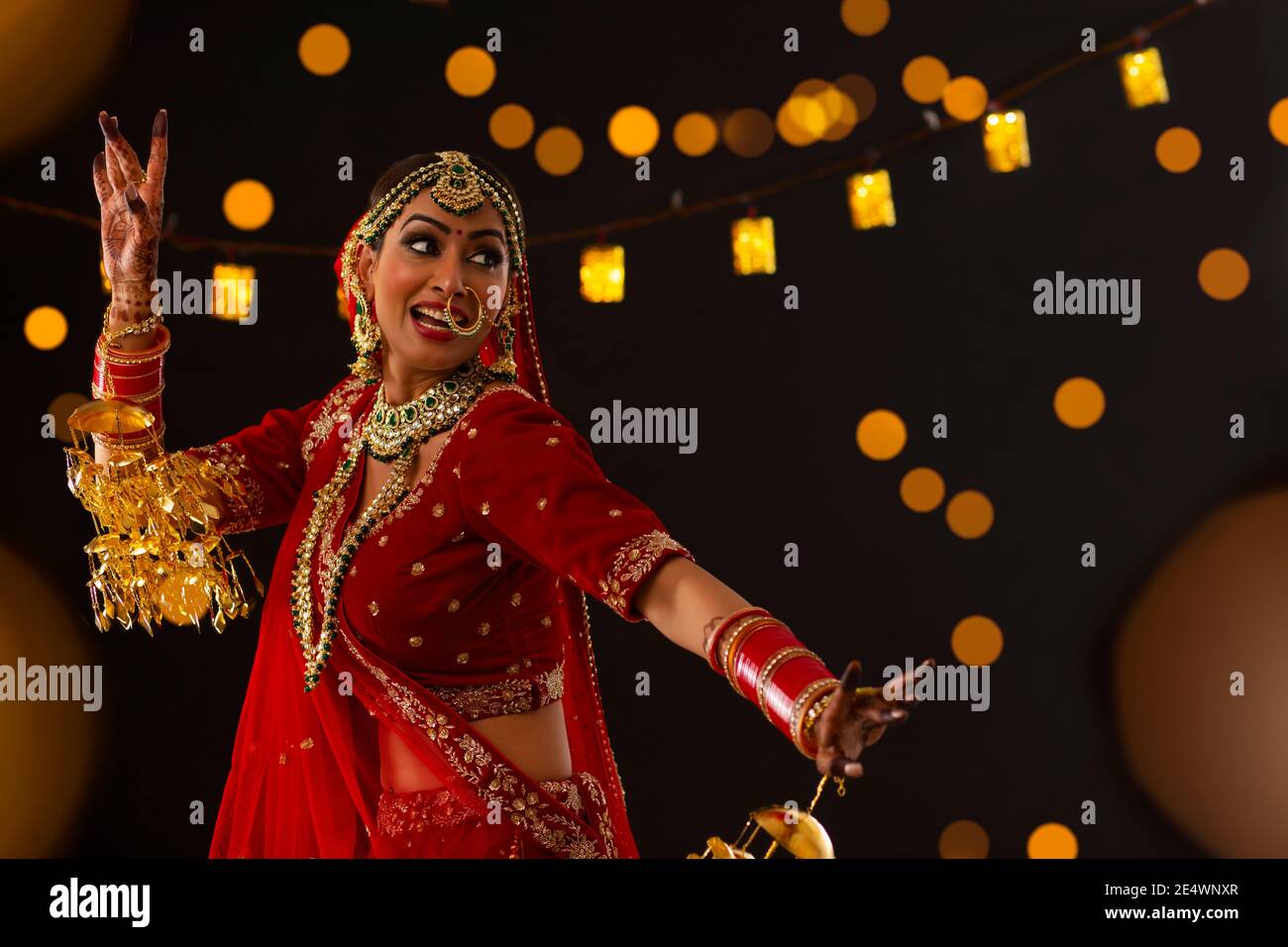 Indian bride dancing at her wedding Stock Photo - Alamy