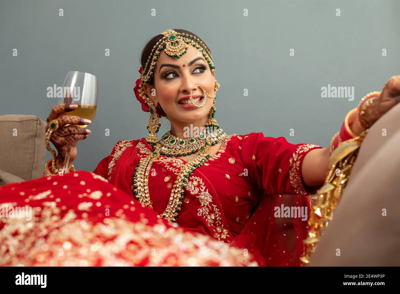 Indian bride with wine glass Stock Photo - Alamy