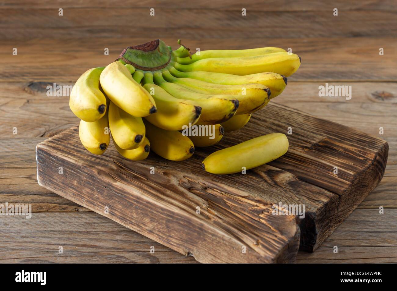 Ripe bananas on woodn background. Tasty healthy tropical fruits Stock ...