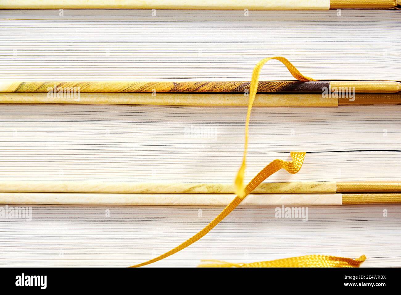 Texture of the stack of closed books with white paper sheets. Books ...