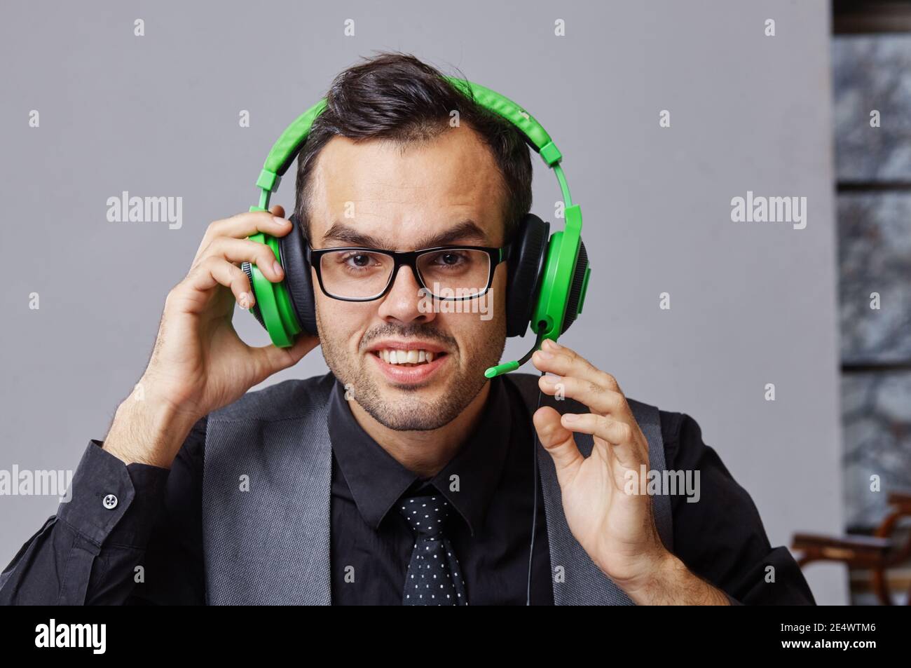 Call center operator man with headsets working Stock Photo - Alamy