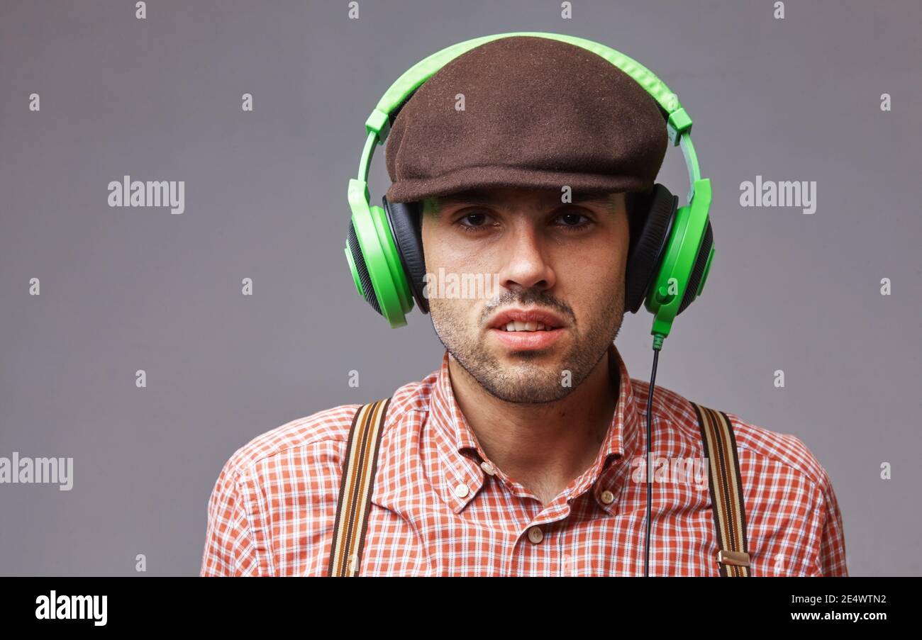 Retro music. Portrait of handsome male dj in fashionable retro styled ...