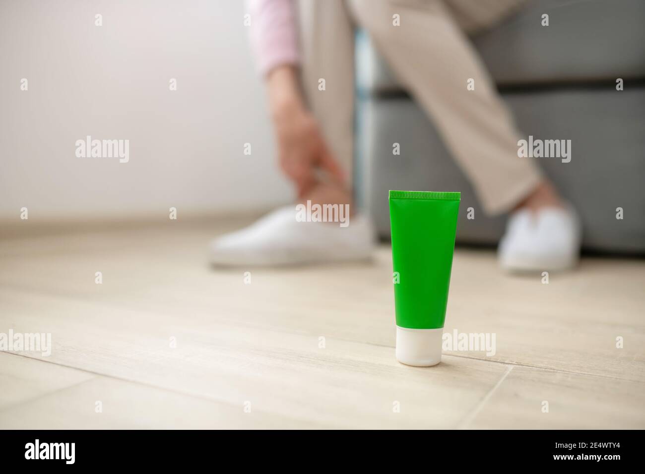 Close up picture of womans hands touching her leg Stock Photo - Alamy