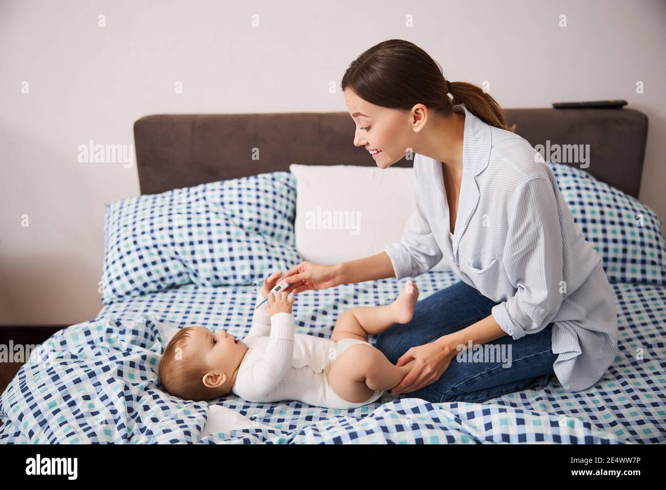 Beautiful female person talking to her baby son Stock Photo - Alamy