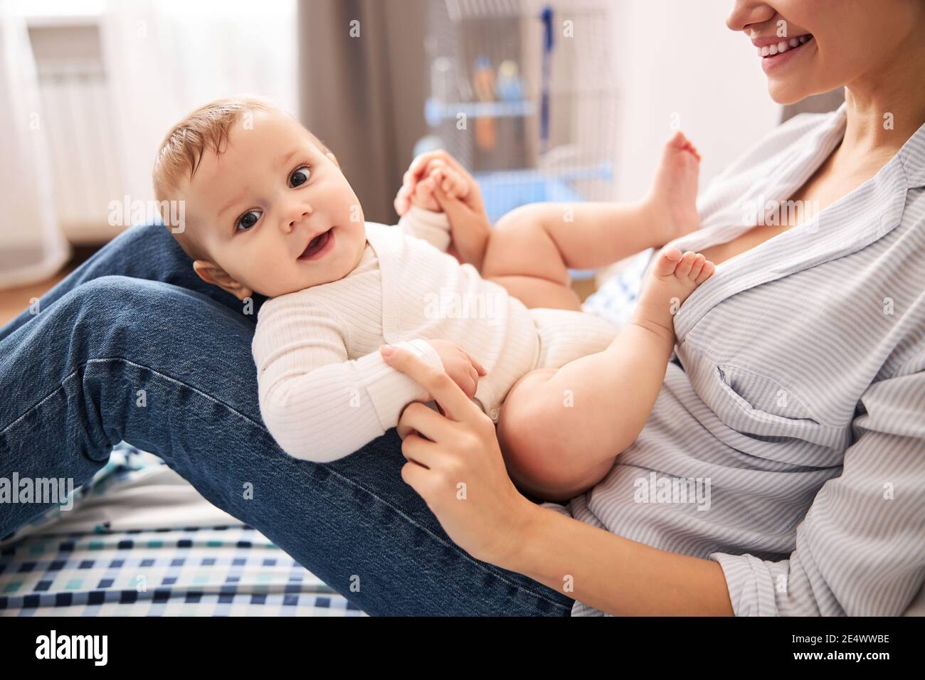 Positive delighted Babyboy looking straight at camera Stock Photo - Alamy