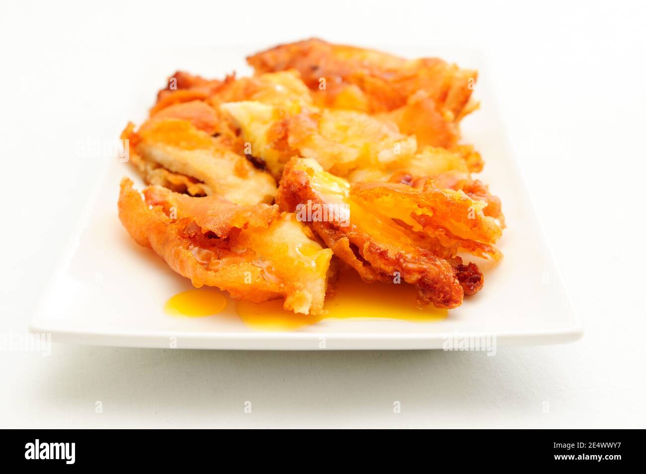 lemon chicken battered and deep fried and lemon sauce Stock Photo - Alamy