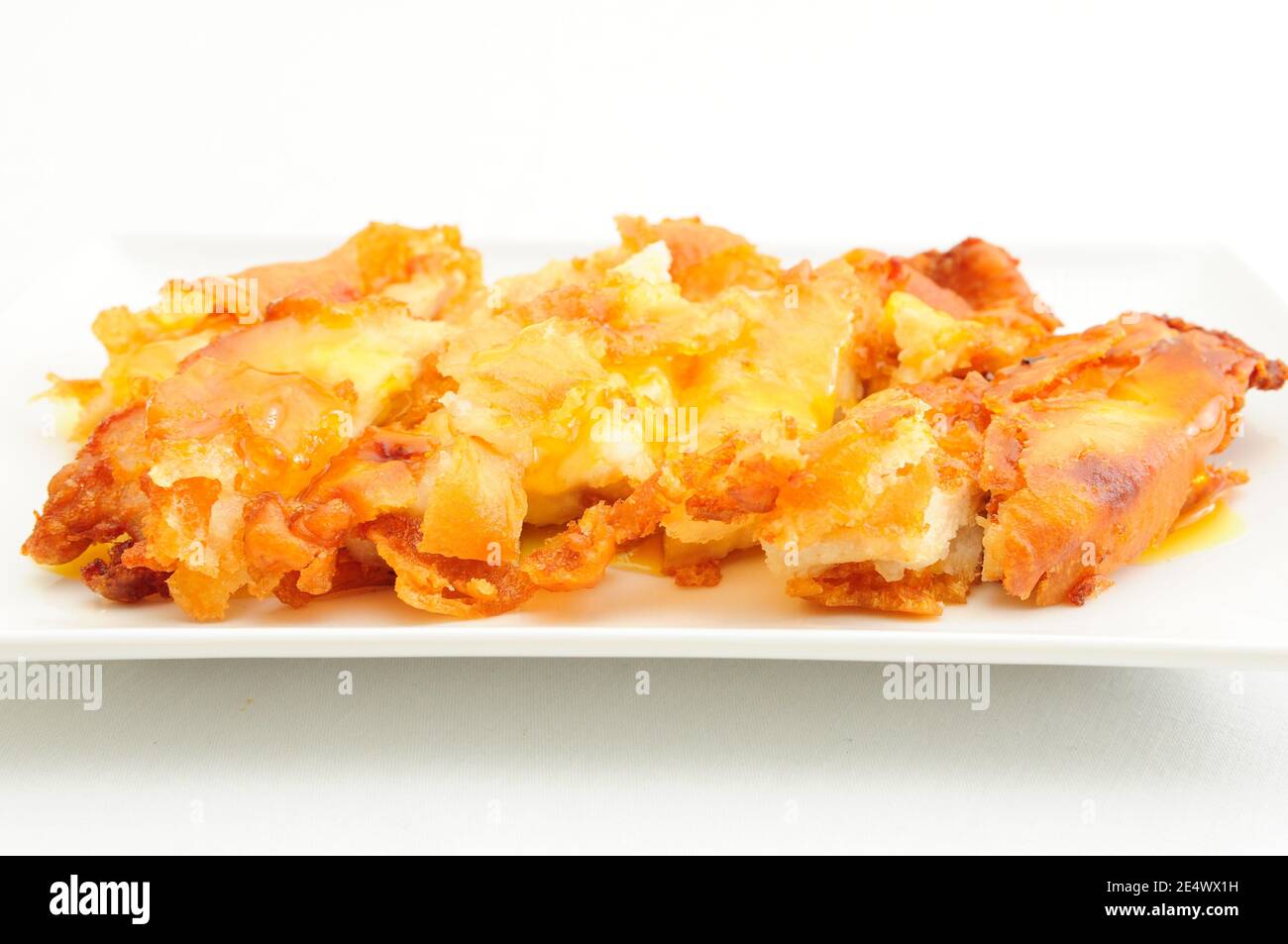 lemon chicken battered and deep fried with lemon sauce Stock Photo - Alamy