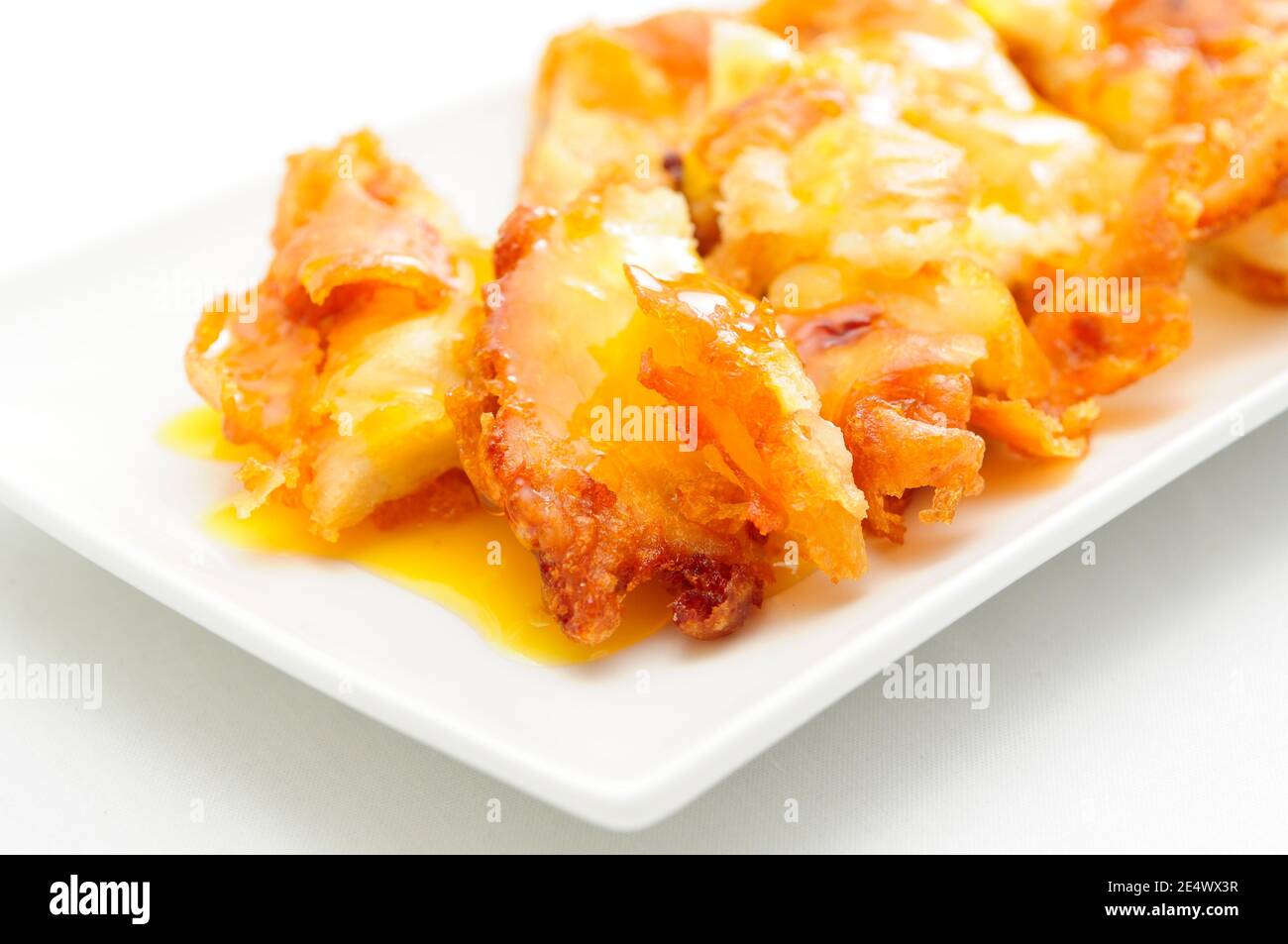 lemon chicken battered and deep fried and lemon sauce Stock Photo - Alamy
