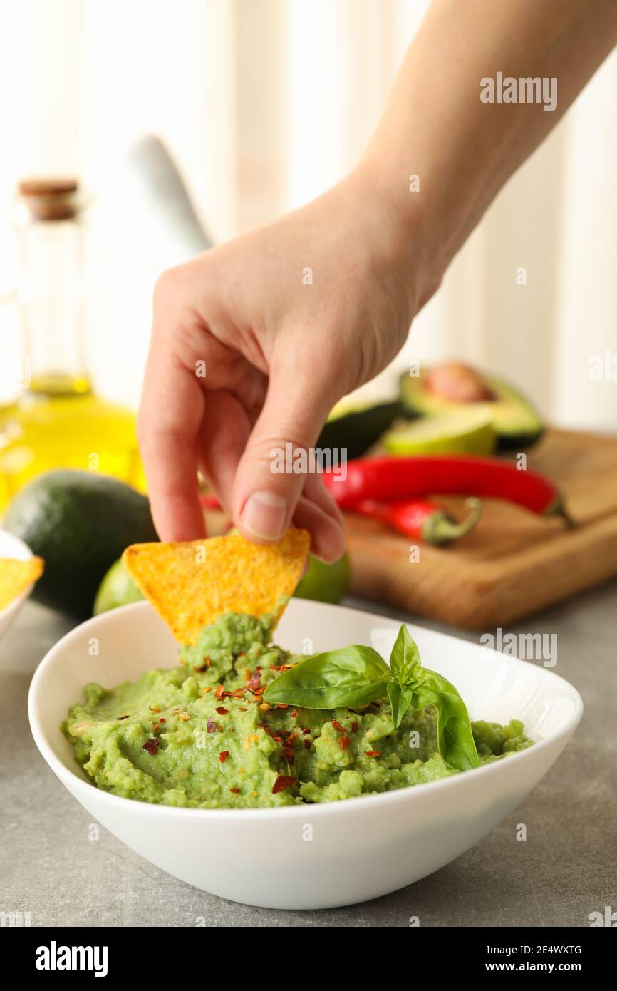 Woman eating chips and dips hi-res stock photography and images - Alamy