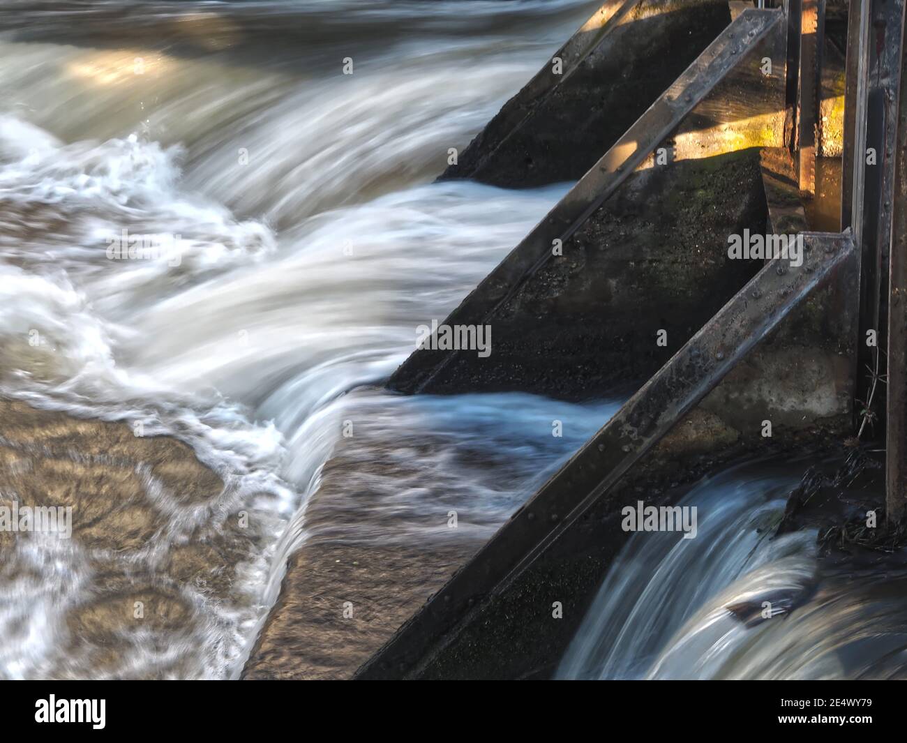 Water falls down in a weir in Grevenbroich in Germany Stock Photo - Alamy