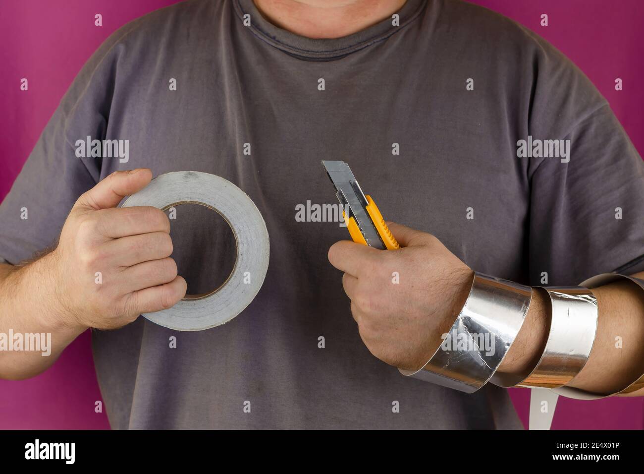 Man is holding a knife with interchangeable blades and aluminum tape ...