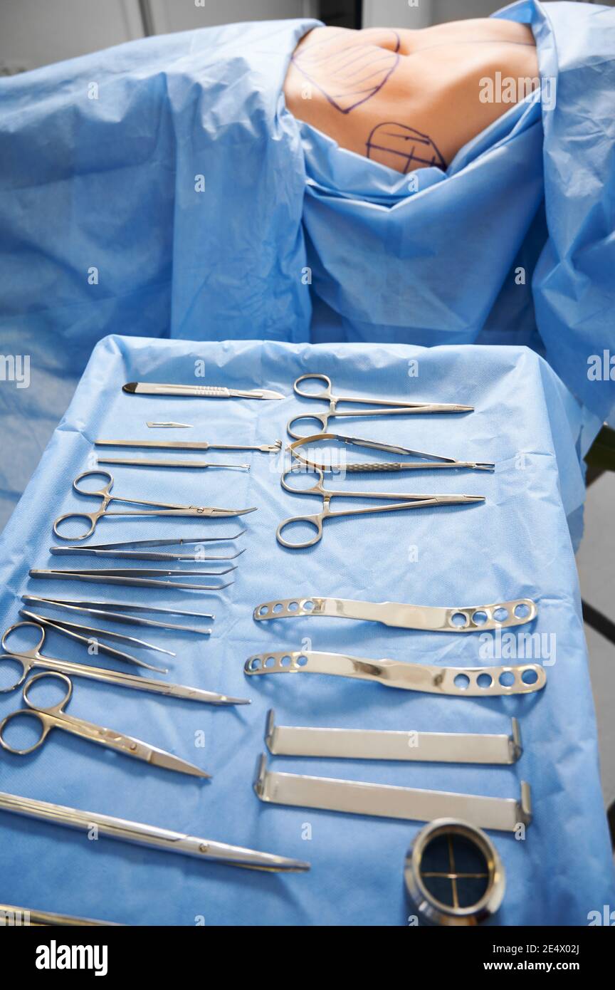 Patient with marks on her body lying on medical bed. Focus on ...